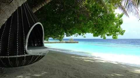 a hanging beach chair at the Maldives on... | Stock Video | Pond5