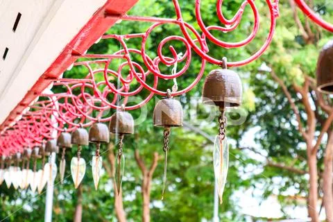 Hanging bells on red wire design and water drop of rain fall ~ Hi Res ...