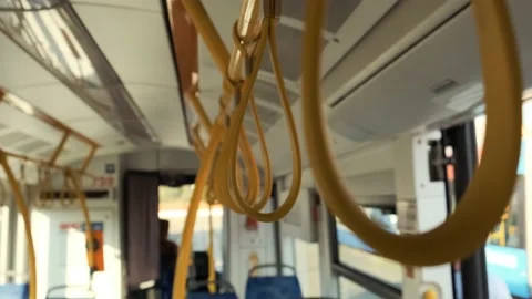 Hanging handrails in a bus. Plastic yell... | Stock Video | Pond5