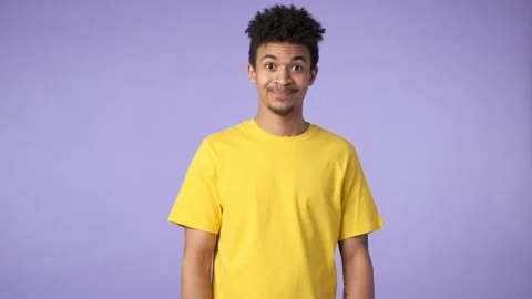 Happy african guy isolated over purple b... | Stock Video | Pond5