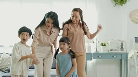 Happy Asian family listen to music and d... | Stock Video | Pond5