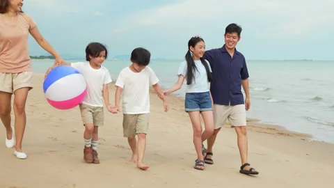 Happy asian family walking outside on th... | Stock Video | Pond5