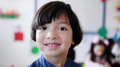 Happy Asian kid smiling at camera inside... | Stock Video | Pond5