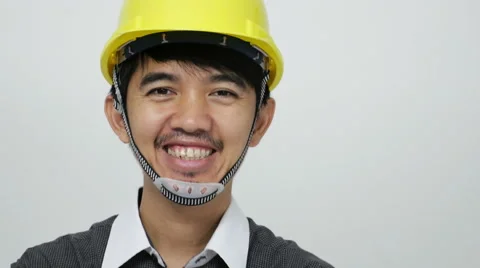 Happy Asian young engineer smiling on wh... | Stock Video | Pond5
