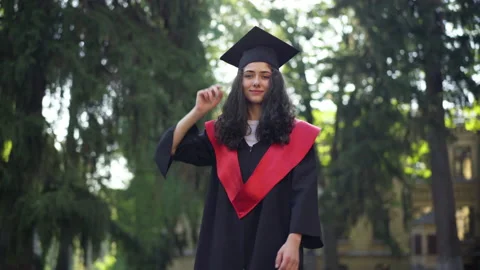 Happy beautiful female student in gradua... | Stock Video | Pond5