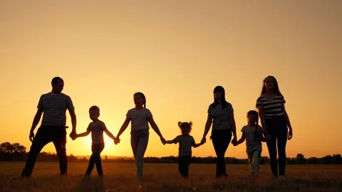 Happy big family in the Park at sunset. ... | Stock Video | Pond5
