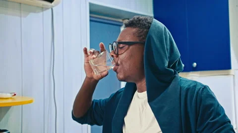 Happy black guy eating breakfast at home | Stock Video | Pond5