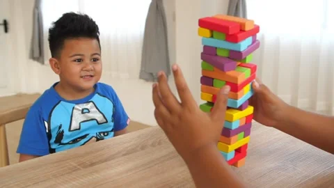 Happy Boy With Falling Wood Block Tower ... | Stock Video | Pond5