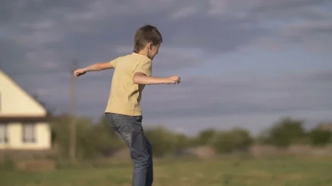 Happy boy running on summer field, happy... | Stock Video | Pond5