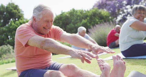Happy caucasian man touching toes with d... | Stock Video | Pond5