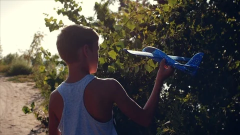 Happy child playing with airplane in the... | Stock Video | Pond5