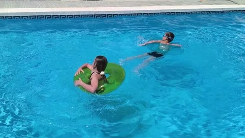 Happy children pool fun splash water hap... | Stock Video | Pond5