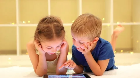 Happy children watching animated cartoon... | Stock Video | Pond5