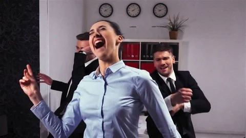 happy colleagues dancing in office room | Stock Video | Pond5