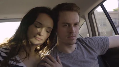 Happy Couple Cuddle In Back Seat Of Car,... | Stock Video | Pond5