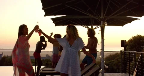 Happy diverse friends with drinks dancin... | Stock Video | Pond5