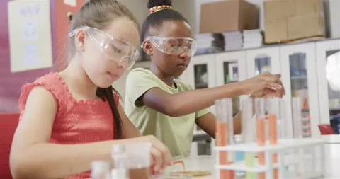 Happy diverse schoolgirls doing experime... | Stock Video | Pond5