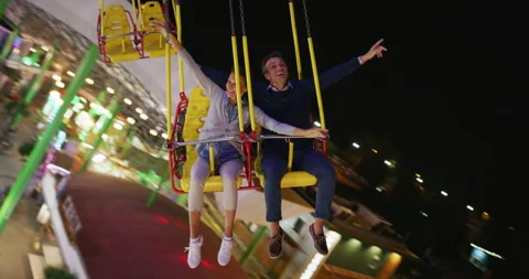 Happy excited couple have fun to ride ch... | Stock Video | Pond5