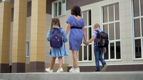 Happy family back to school. Mom and chi... | Stock Video | Pond5