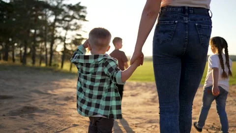 Happy family concept.Children walk throu... | Stock Video | Pond5