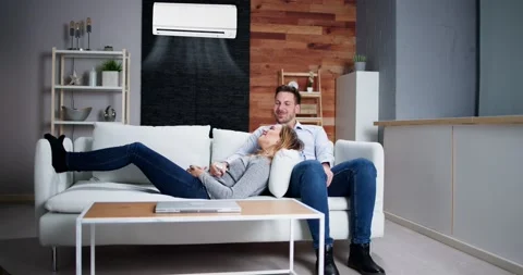 Happy Family Couple Using Air Conditione... | Stock Video | Pond5