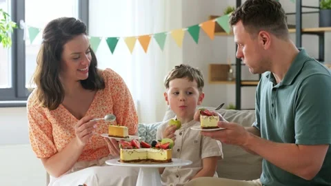 happy family eating birthday cake at hom... | Stock Video | Pond5