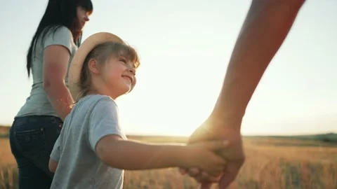 Happy family. Hand in hand parents and d... | Stock Video | Pond5