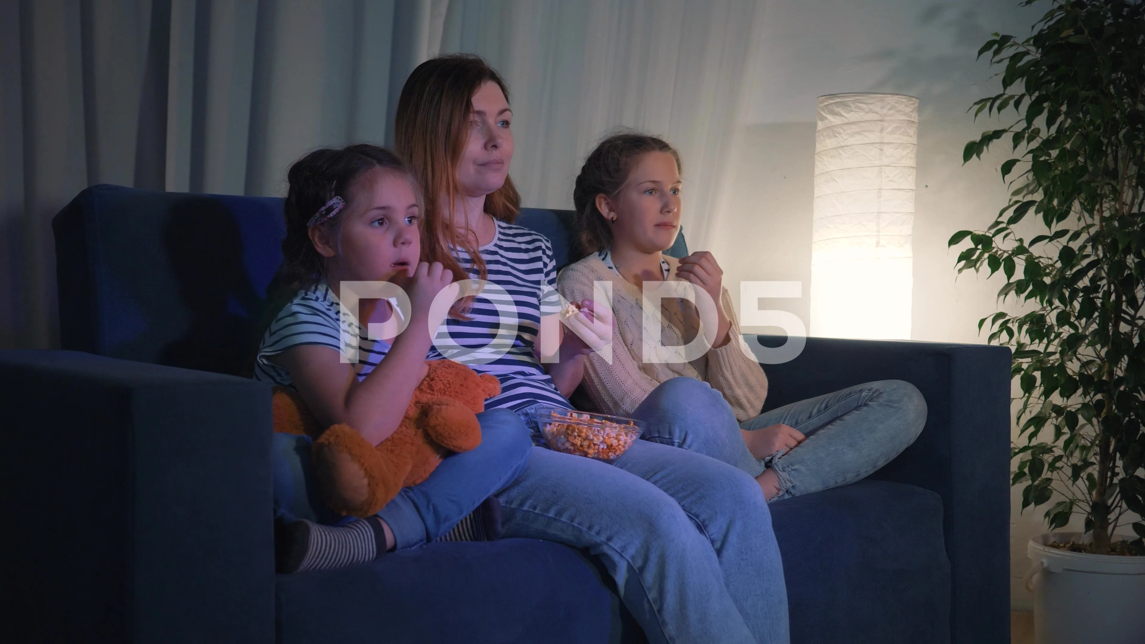 Family Watching Tv At Night