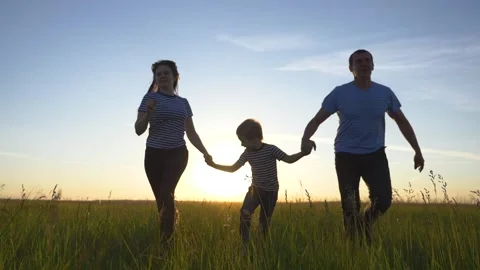 Happy family in the park. Teamwork. Grou... | Stock Video | Pond5