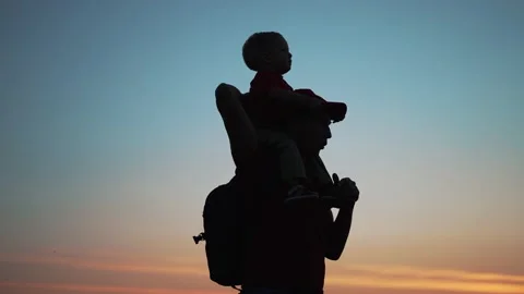Happy family. Son sitting on neck of the... | Stock Video | Pond5