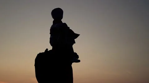 Happy family. Son sitting on neck of the... | Stock Video | Pond5