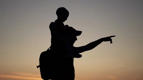Happy family. Son sitting on neck of the... | Stock Video | Pond5