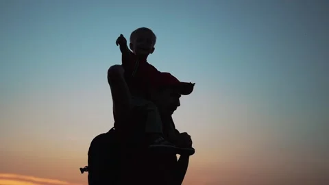 Happy family. Son sitting on neck of the... | Stock Video | Pond5