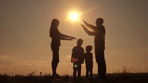 happy family teamwork silhouette shows a... | Stock Video | Pond5