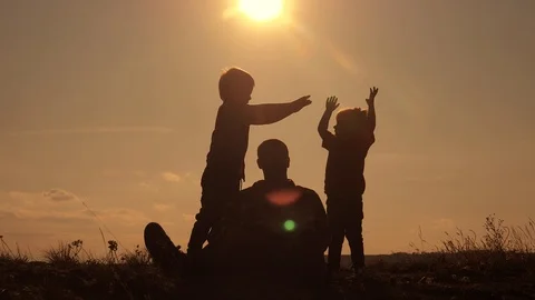 happy family teamwork silhouette shows a... | Stock Video | Pond5