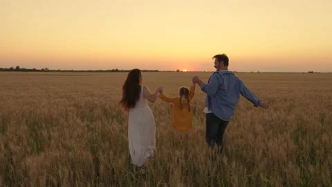 Happy family with their daughter run hol... | Stock Video | Pond5