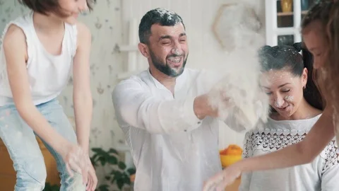 Happy family throw flour to each other, ... | Stock Video | Pond5