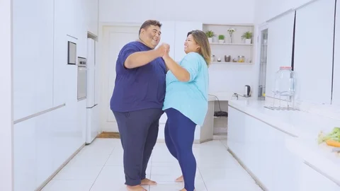 Happy fat couple dancing together in the... | Stock Video | Pond5