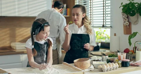 Happy father in apron cooking baking hom... | Stock Video | Pond5