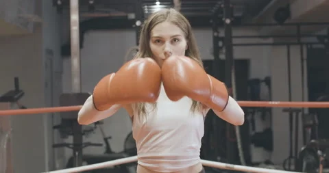 Happy female boxer posing on boxing ring... | Stock Video | Pond5