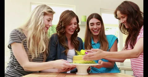 Happy friends eating cake with hands | Stock Video | Pond5