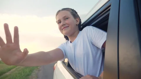 happy girl kid child leaned out of a car... | Stock Video | Pond5