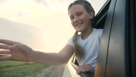 happy girl kid child leaned out of a car... | Stock Video | Pond5