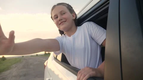 happy girl kid child leaned out of a car... | Stock Video | Pond5