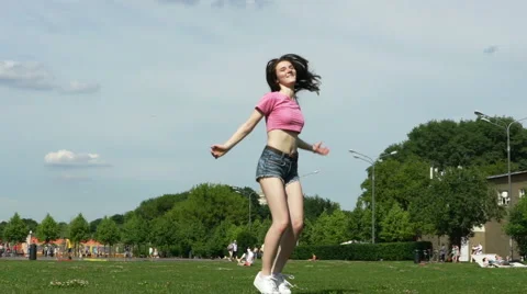 Happy girls in short shorts jump in slow... | Stock Video | Pond5