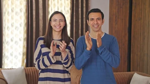 Happy Indian couple clapping and cheerin... | Stock Video | Pond5