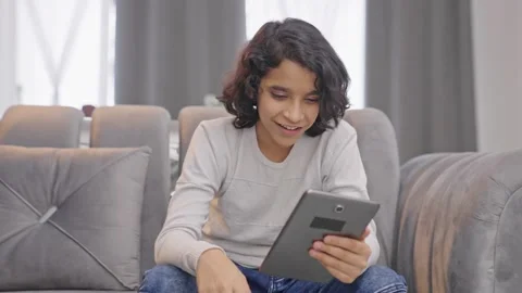 Happy Indian kid boy scrolling through t... | Stock Video | Pond5