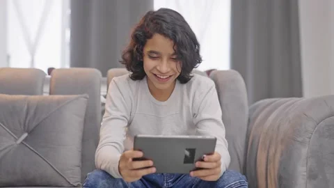 Happy Indian kid boy watching videos on ... | Stock Video | Pond5