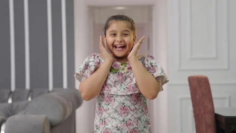 Happy Indian kid girl getting surprised | Stock Video | Pond5
