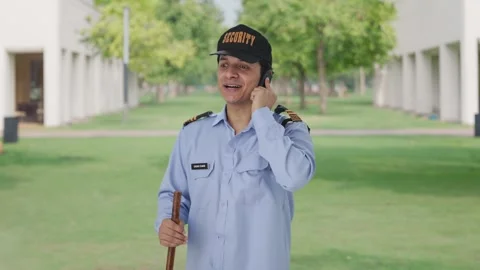 Happy Indian security guard talking on p... | Stock Video | Pond5